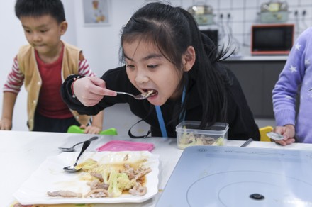Girl Tastes Dish Cooked By Her Editorial Stock Photo - Stock Image ...