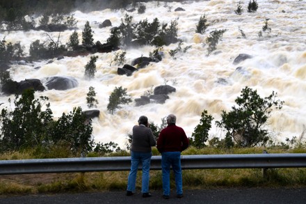 Overflow water spills from Wyangala Dam, locals along the Lachlan River ...