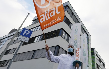 Attac activists protest outside BionTech headquarters in Mainz, Germany ...