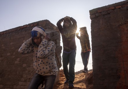 Migrant workers labor at a brick factory in Pharping, Kathmandu, Nepal ...