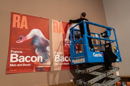 MAN ON CHERRY PICKER ADJUSTS POSTER Editorial Stock Photo - Stock Image ...
