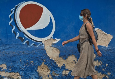 Woman Wearing Face Mask Walks Past Editorial Stock Photo - Stock Image ...