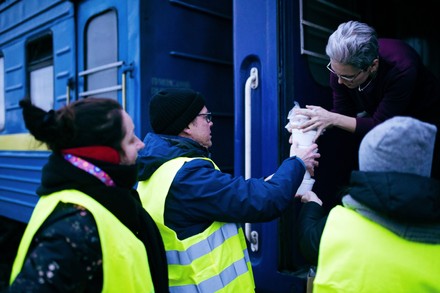 Refugees from Ukraine are waiting at the railway station in Chelm ...