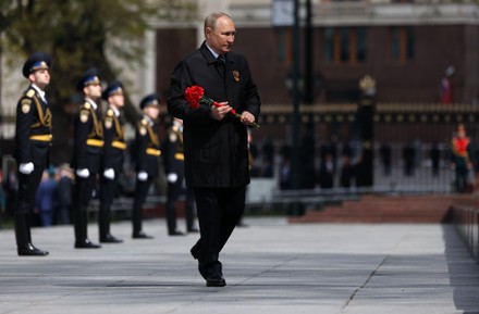 Russian President Vladimir Putin attends a flower-laying ceremony ...