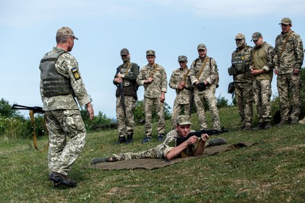 Servicemen Stand Over Soldier Taking Prone Editorial Stock Photo ...