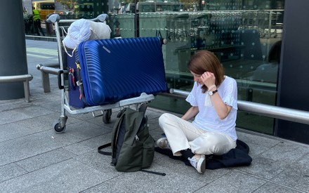 Passengers Sitting On Floor Outside London Editorial Stock Photo ...