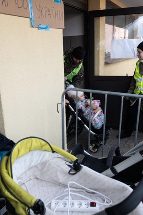 Soldier Helps Woman Pushing Stroller Exit Editorial Stock Photo - Stock ...