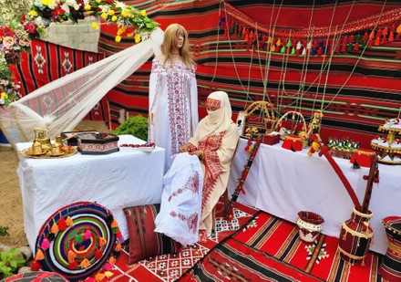 Palestinian Mona Abu Rida, embroiders traditional Palestinian dresses ...