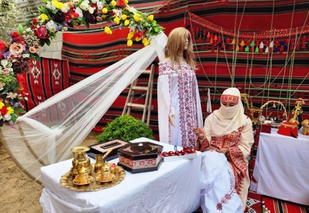 Palestinian Mona Abu Rida, embroiders traditional Palestinian dresses ...