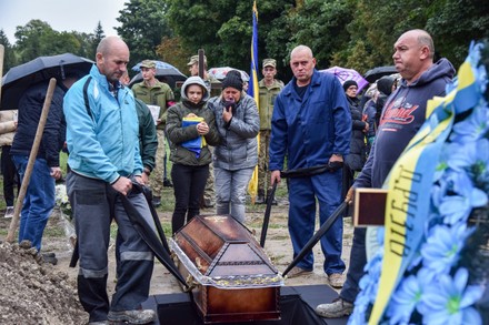 Undertaker Lowers Coffin Into Grave During Editorial Stock Photo ...