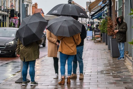 People Sheltering Underneath Umbrellas During Rain Editorial Stock ...