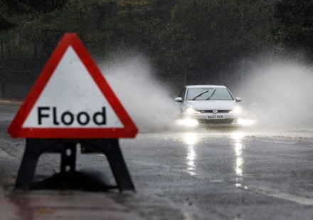 Cars Drive Through Flooding On Road Editorial Stock Photo - Stock Image ...
