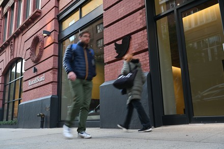 People Walk Past Building That Houses Editorial Stock Photo - Stock ...