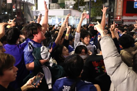 __COUNT__ Japanese football fans celebrate Japan's victory at the FIFA ...