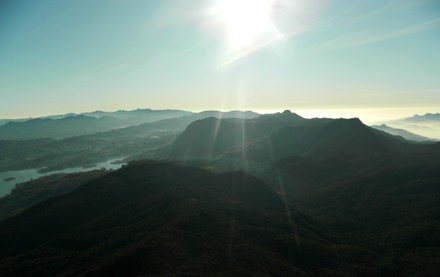 View Sun Rise Through Distant Mountains Editorial Stock Photo - Stock ...