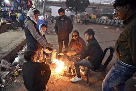 People Huddled Around Bonfire During Morning Editorial Stock Photo ...
