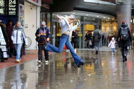 Woman Jumps Over Large Puddle Rainwater Editorial Stock Photo - Stock ...