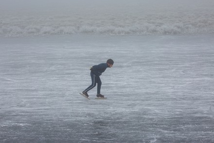 Skaters On Foggy Frozen Fen Near Editorial Stock Photo - Stock Image ...