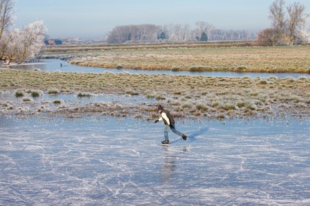 People Skating On Frozen Fen Near Editorial Stock Photo - Stock Image ...