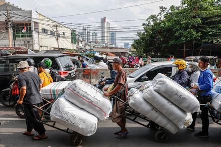 Porters Drag Sacks Clothes On Their Editorial Stock Photo - Stock Image ...