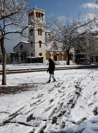 Man Walks Snow Covered Square During Editorial Stock Photo - Stock ...