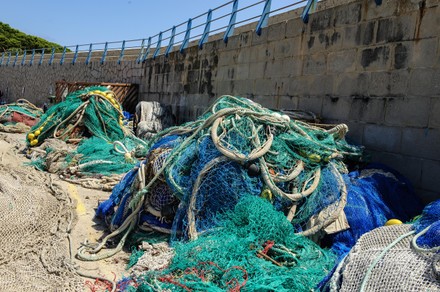 Fishing Nets Lying Piled On Harbour Editorial Stock Photo - Stock Image ...