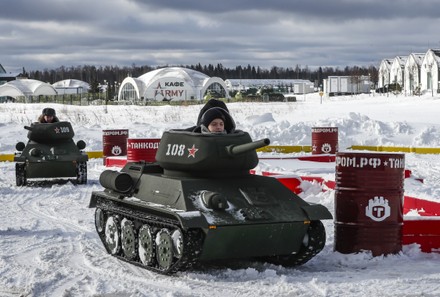 __COUNT__ Russian people ride on miniature Soviet tank models in ...
