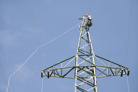 Worker On Electricity Pylon Attaching Cable Editorial Stock Photo ...