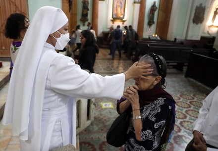 Nun Applies Ashes On Devotees Forehead Editorial Stock Photo - Stock ...