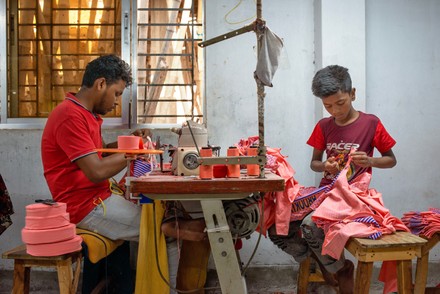 Kid Working Besides His Elderly Colleague Editorial Stock Photo - Stock ...