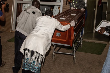 Morgue Attendants Push Casket Containing Body Editorial Stock Photo ...