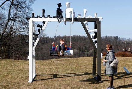 Boy Sits On Swing On Display Editorial Stock Photo - Stock Image ...