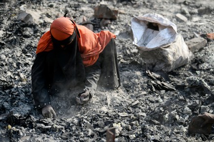 Women Look Through Burnt Cloth Materials Editorial Stock Photo - Stock ...