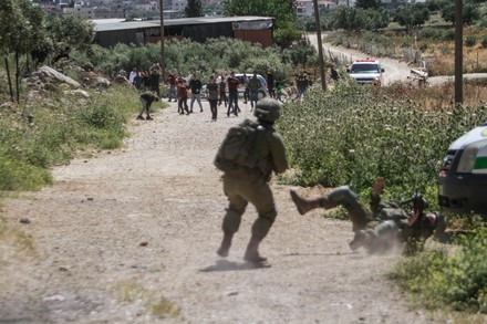 Palestinian Protesters Hurl Stones Israeli Soldiers Editorial Stock ...
