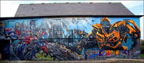 Huge Transformers mural created on side of building by graffitti ...