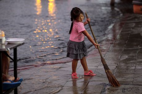 Little Girl Sweeping Away Flood Water Editorial Stock Photo - Stock ...