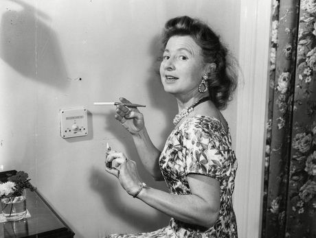 MOLLY WEIR ACTRESS CIGARETTE HOLDER 1958 Editorial Stock Photo - Stock ...