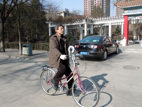 Yu Jianming Rides His Bike By Editorial Stock Photo - Stock Image ...