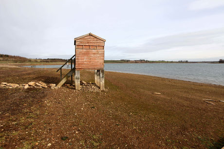 Dry Reservoir Bed Exposed By Drought Editorial Stock Photo - Stock ...