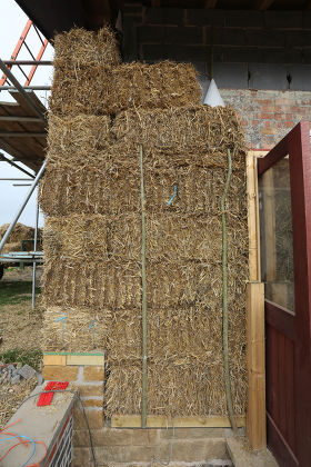 Builders Using Straw Insulation On New Editorial Stock Photo - Stock ...