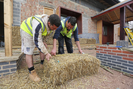 Builders Using Straw Insulation On New Editorial Stock Photo - Stock ...