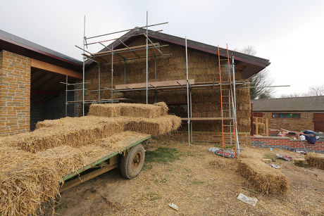 Builders Using Straw Insulation On New Editorial Stock Photo - Stock ...