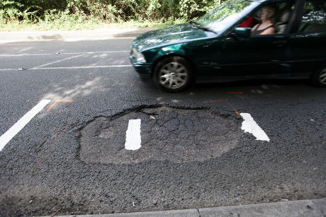 White Line Painted Pothole Editorial Stock Photo - Stock Image ...