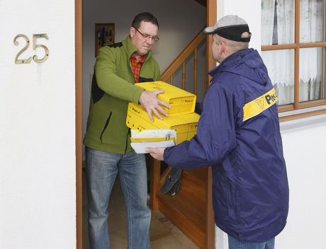 Model Released Postman Delivering Packages Editorial Stock Photo ...