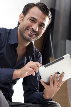 Model Released Smiling Man Holding Ipad Editorial Stock Photo - Stock ...