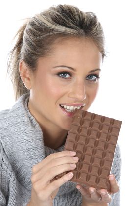 Model Released Woman Eating Chocolate Bar Editorial Stock Photo - Stock ...