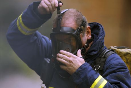 Firefighter Putting On Gas Mask Editorial Stock Photo - Stock Image ...