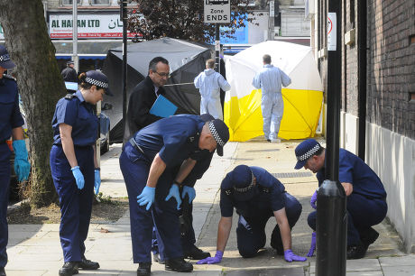 Police Officers Collecting Evidence Editorial Stock Photo - Stock Image ...