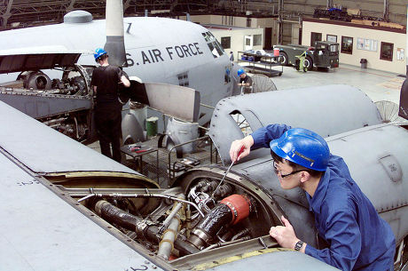 1 C130 c 130 hercules military aircraft with army engineer working on ...