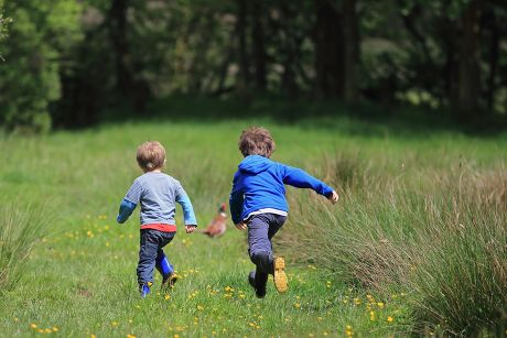 Two Young Boys Running Chasing After Editorial Stock Photo - Stock ...